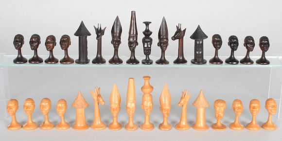 Bonhams : A post World War II Kenyan hardwood bust chess set