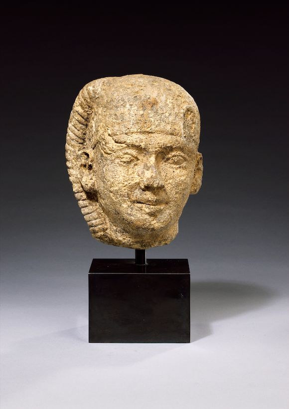 Bonhams : An Egyptian limestone head of Harpocrates