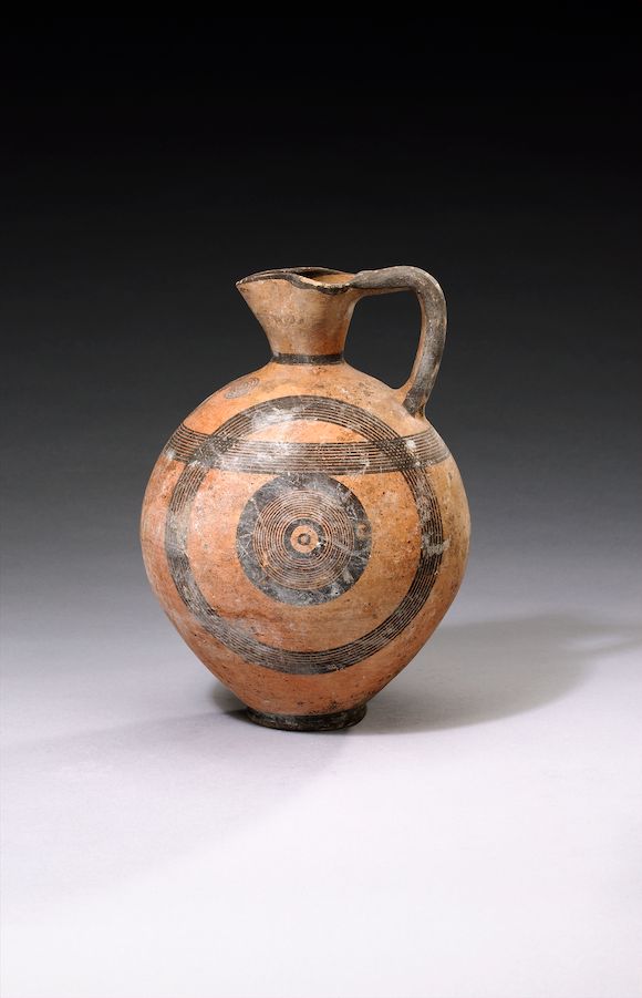 Bonhams : A Cypriot black-on-red ware pottery oinochoe