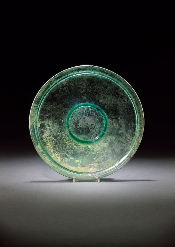 Bonhams : A large Roman green glass plate