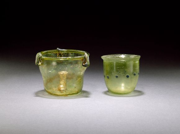 Bonhams : A Roman olive green glass beaker and a Byzantine olive green ...
