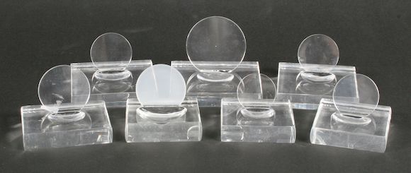 Bonhams : A quantity of perspex paperweight stands