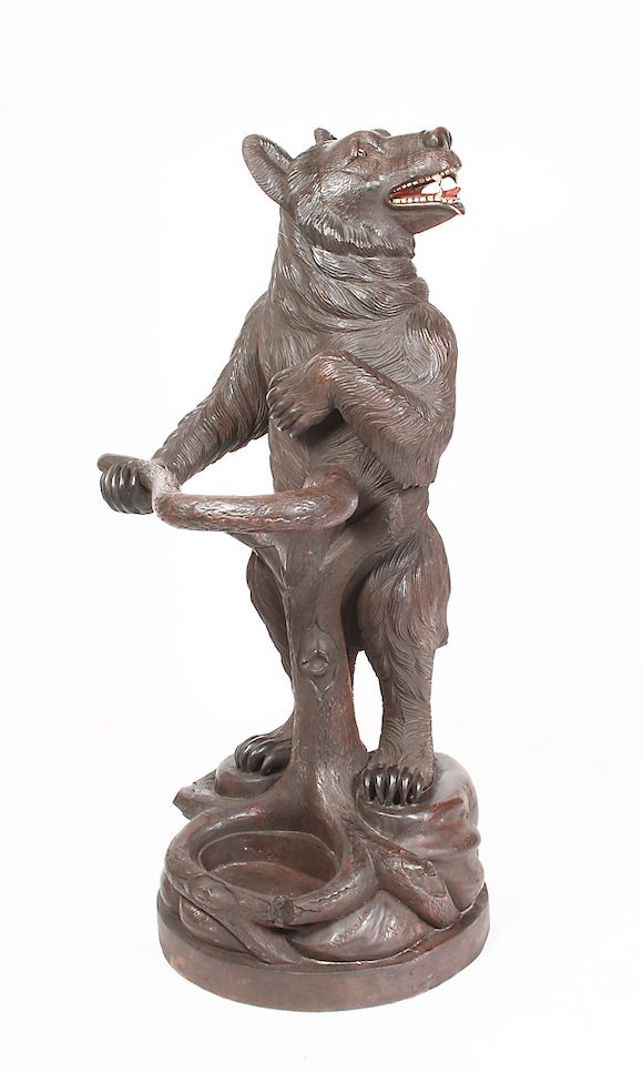 Bonhams : A carved and stained bear stick stand