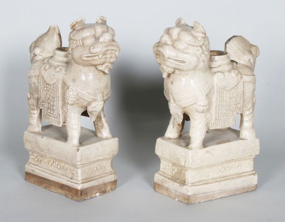 Bonhams : A pair of Chinese straw glazed earthenware models of standing ...
