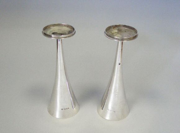 Bonhams : STUART DEVLIN : A pair of silver candlestick bases, London 1972,