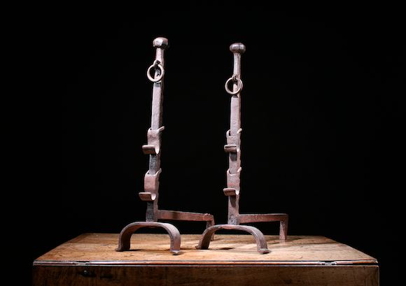 Bonhams : A near pair of 18th Century iron adjustable spit-dogs