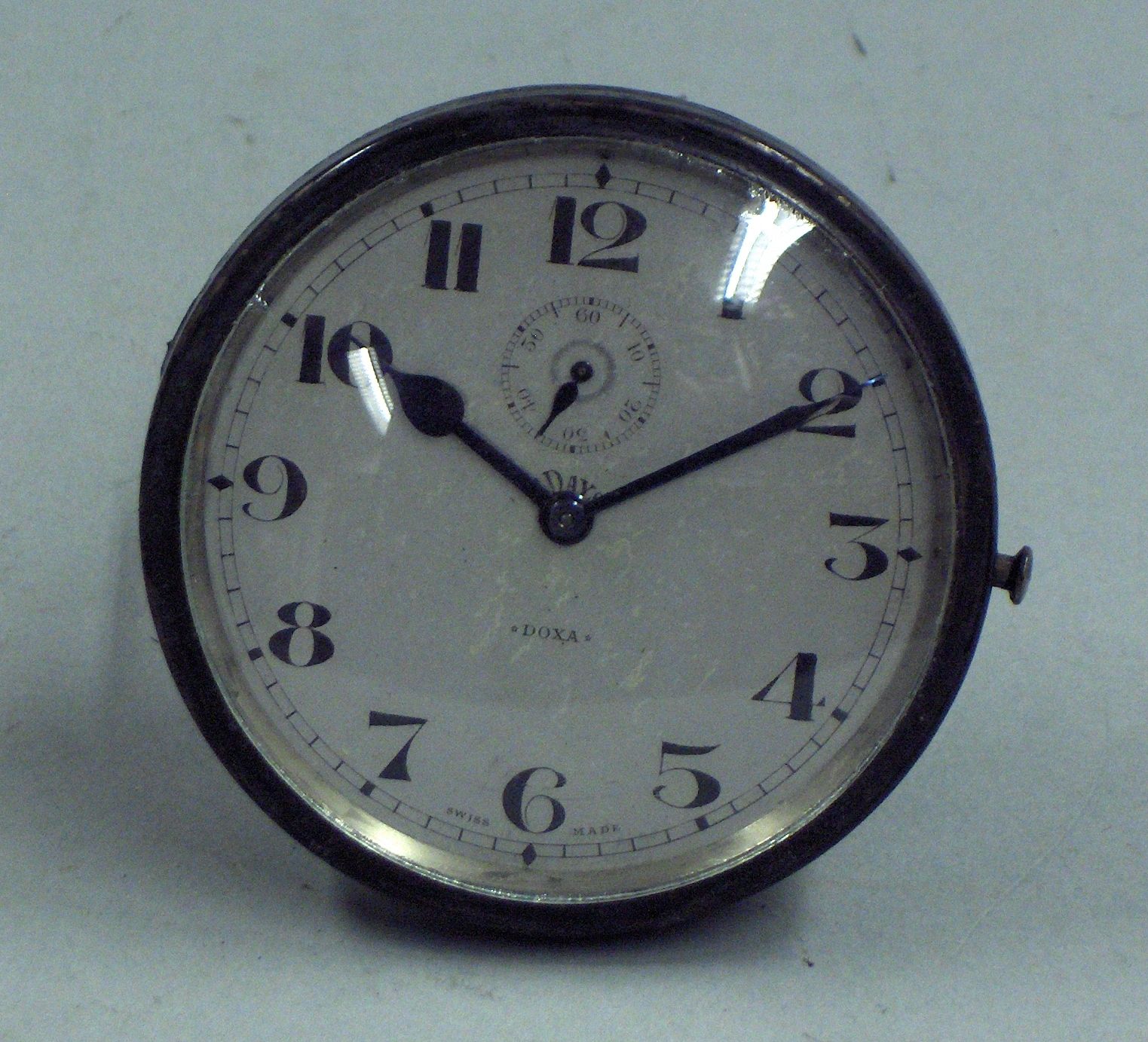 Bonhams Cars : A Doxa eight day car clock,