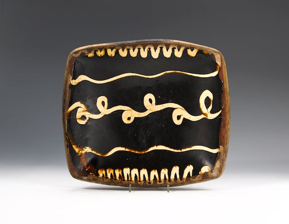 Bonhams : A large Staffordshire slipware dish mid 18th century