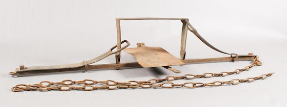 Bonhams : An antique weathered iron man trap