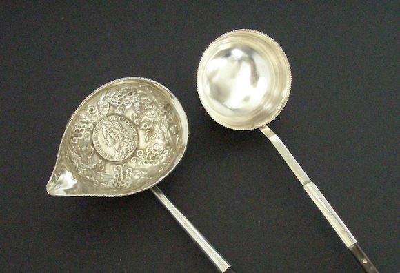 Bonhams : A 19th century silver toddy ladle, unmarked, (2)