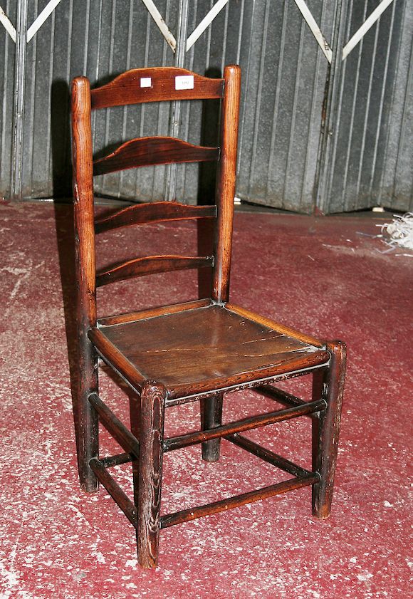 Bonhams : An ash and elm ladder back chair, with solid seat, and a 19th ...