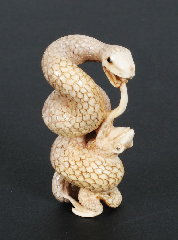 Bonhams : A Japanese ivory netsuke of a snake and a toad