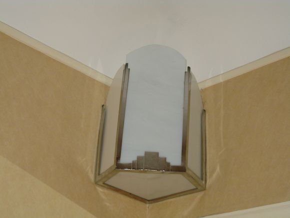 Bonhams : A set of four frosted glass corner uplighters