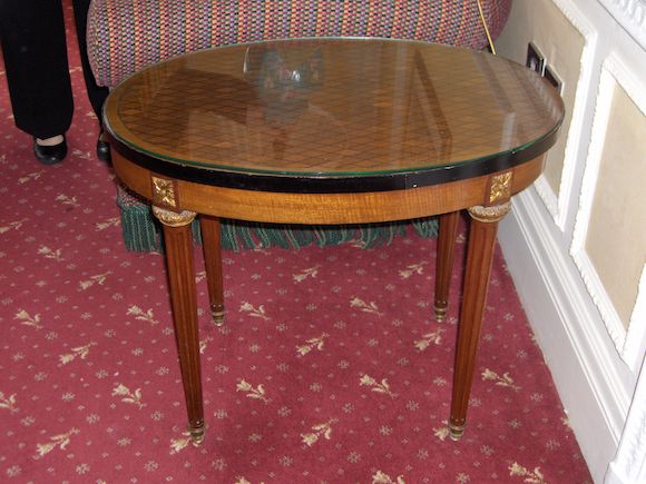 Bonhams : A pair of walnut, parquetry and gilt metal mounted oval low tables