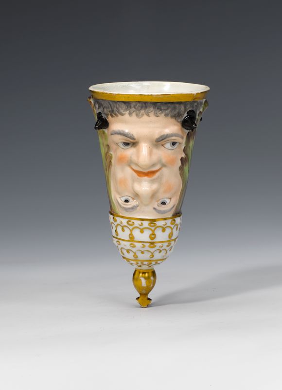 Bonhams : A fine and rare Derby 'Pope and the Devil' stirrup cup circa 1820
