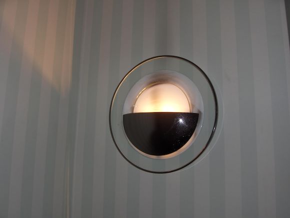 Bonhams : A circular glass wall light
