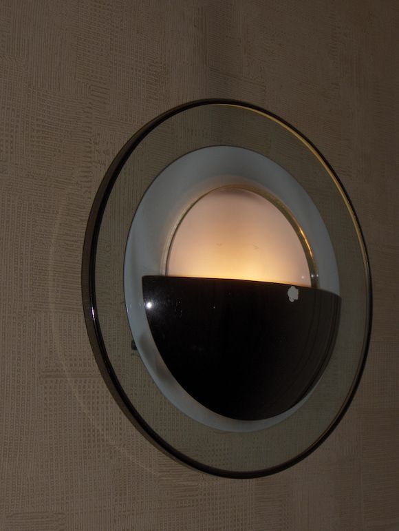 Bonhams : A circular glass wall light