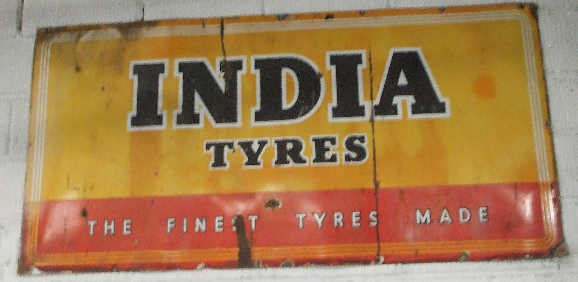 Bonhams Cars : A large India Tyres enamel sign,