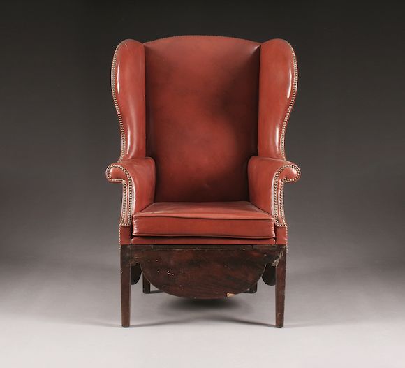 Bonhams : A George III leather upholstered wing back commode armchair