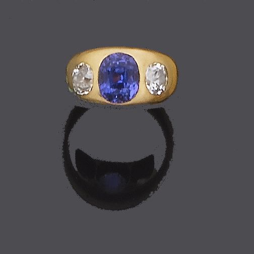 Bonhams : A colour change sapphire and diamond three-stone ring