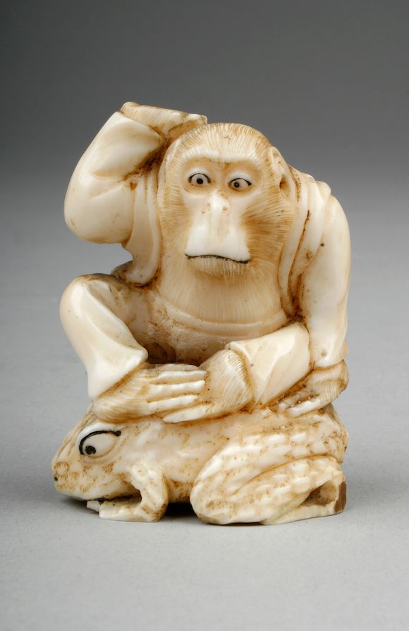 Bonhams : A Japanese ivory carving of a monkey seated on a toad