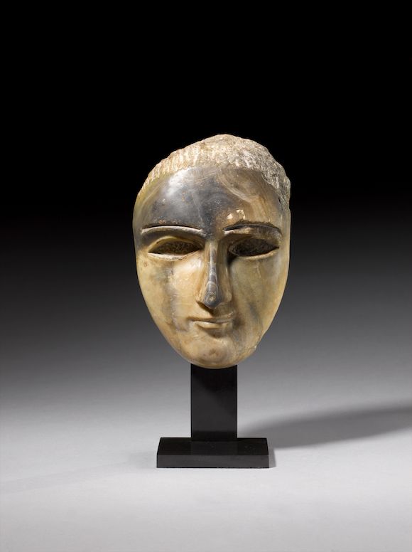 Bonhams : A South Arabian veined alabaster face mask
