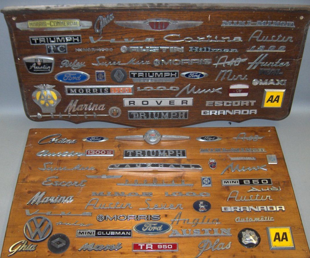 Bonhams Cars : Four display boards of assorted marque scripts and badges,