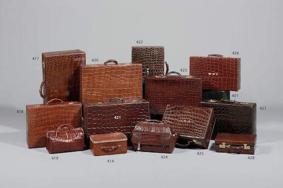 Bonhams : A 1930s light brown crocodile leather 24 inch suitcase, possibly by The Northwest ...