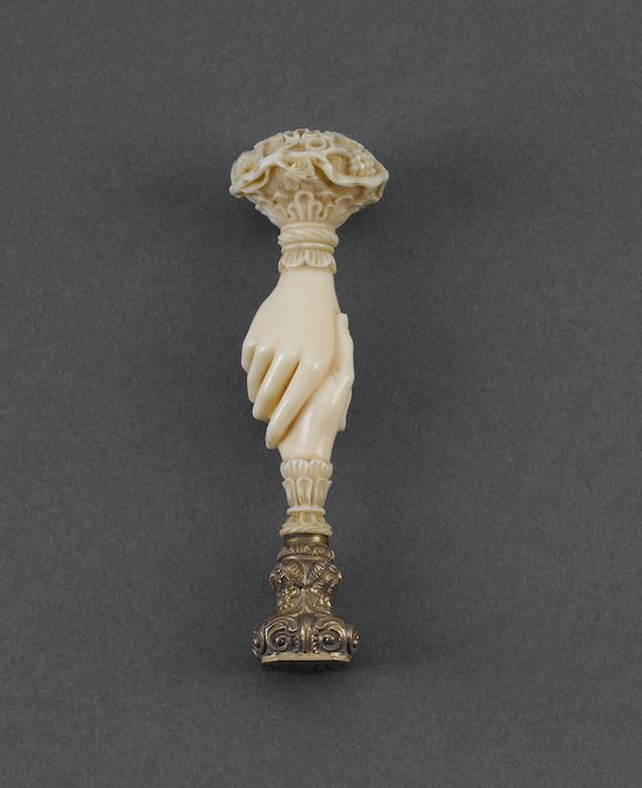 Bonhams : A Victorian carved ivory and silver mounted 'joined hands' seal,