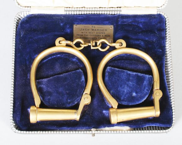 Bonhams : A set of presentation gilded hand cuffs