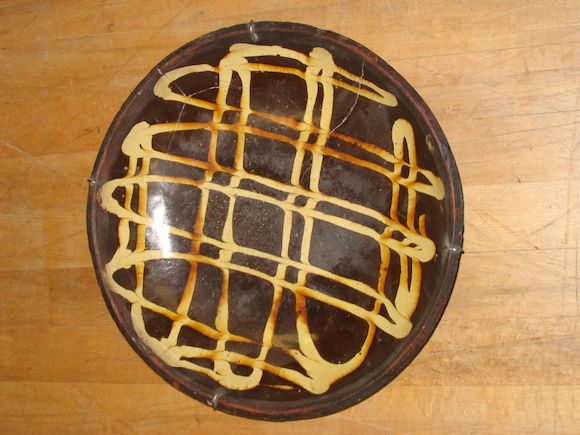 Bonhams : An 18th Century circular slipware dish