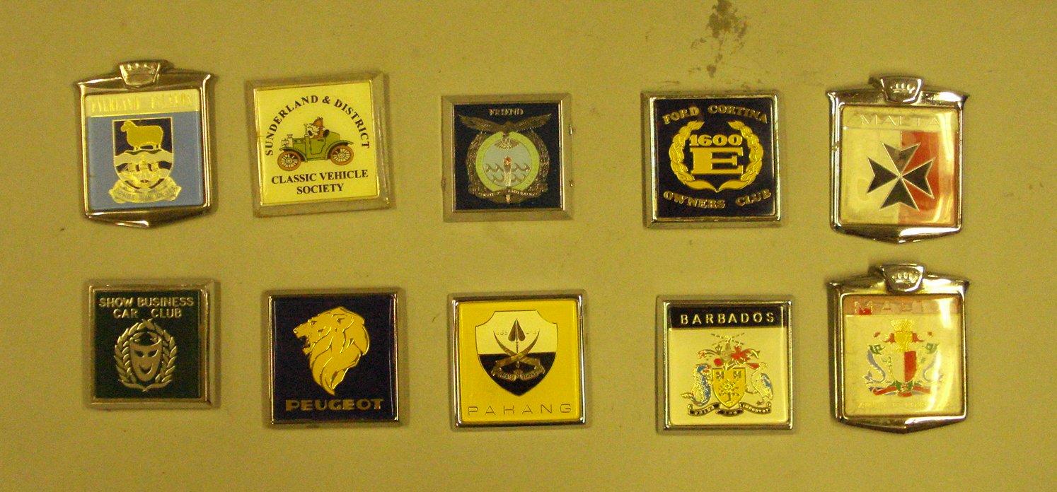 Bonhams Cars : Ten square car badges,