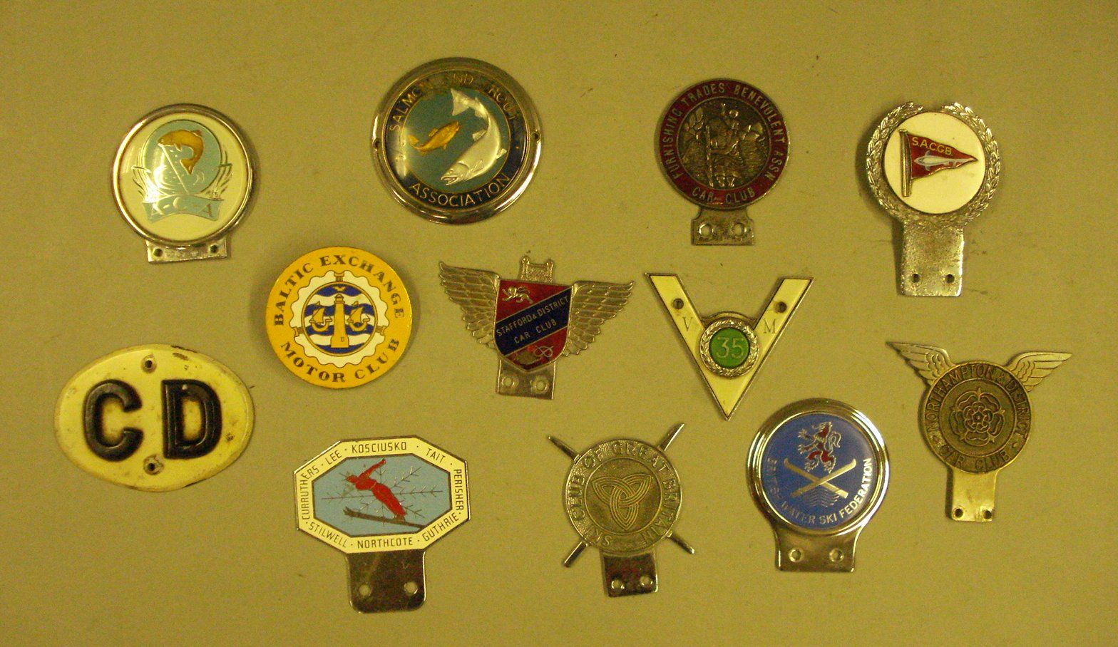 Bonhams Cars : Twelve car badges,