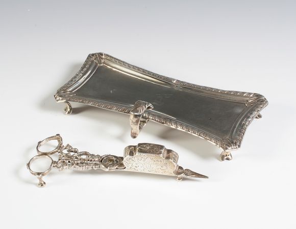 Bonhams : An early George III silver snuffers tray and a pair of matched snuffers The tray with ...