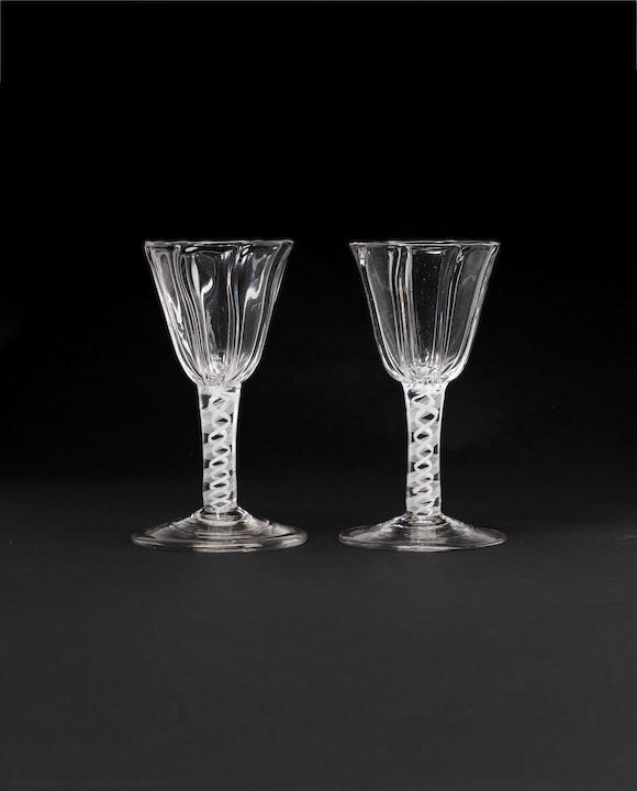 Bonhams A Pair Of Opaque Twist Wine Glasses Circa 1765