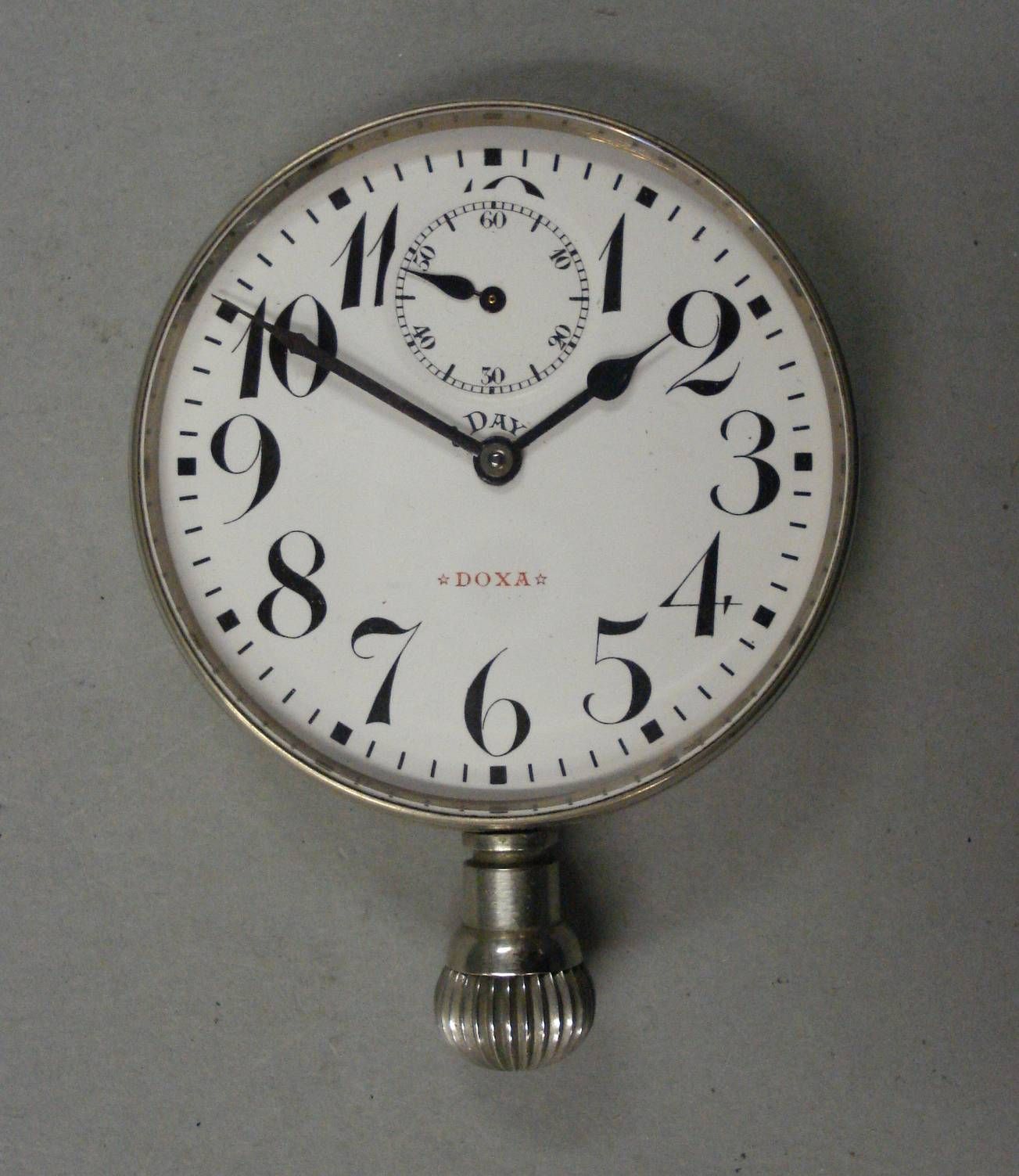 Bonhams Cars : A Doxa eight day car clock, Swiss,