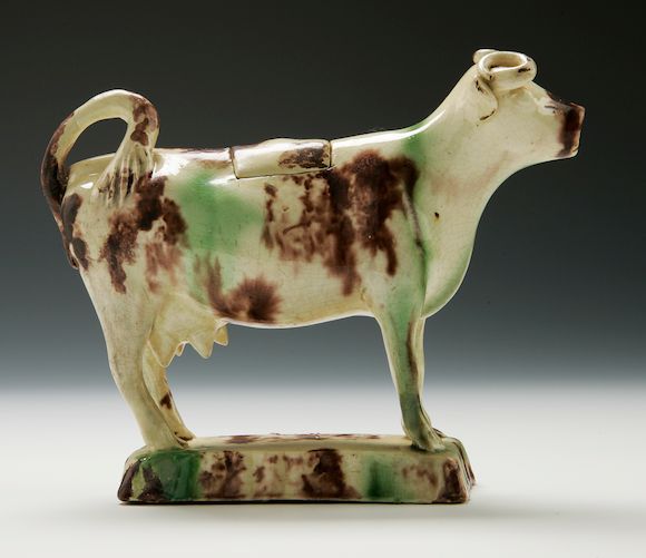 Bonhams : A Wheildon-style cream ware cow creamer 18th century