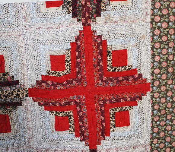 Bonhams : A late 19th/early 20th century 'log cabin' patchwork quilt