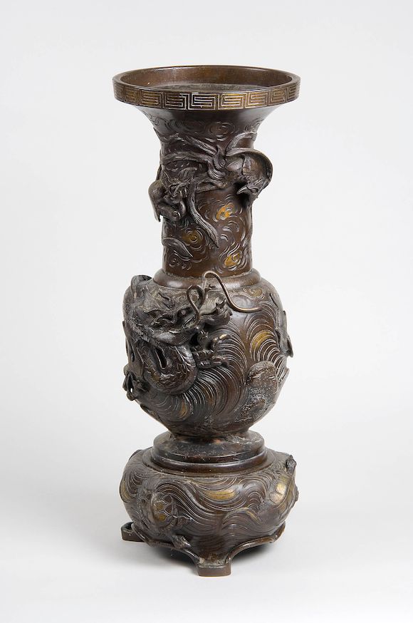 Bonhams : A large Japanese bronze sectional relief moulded vase