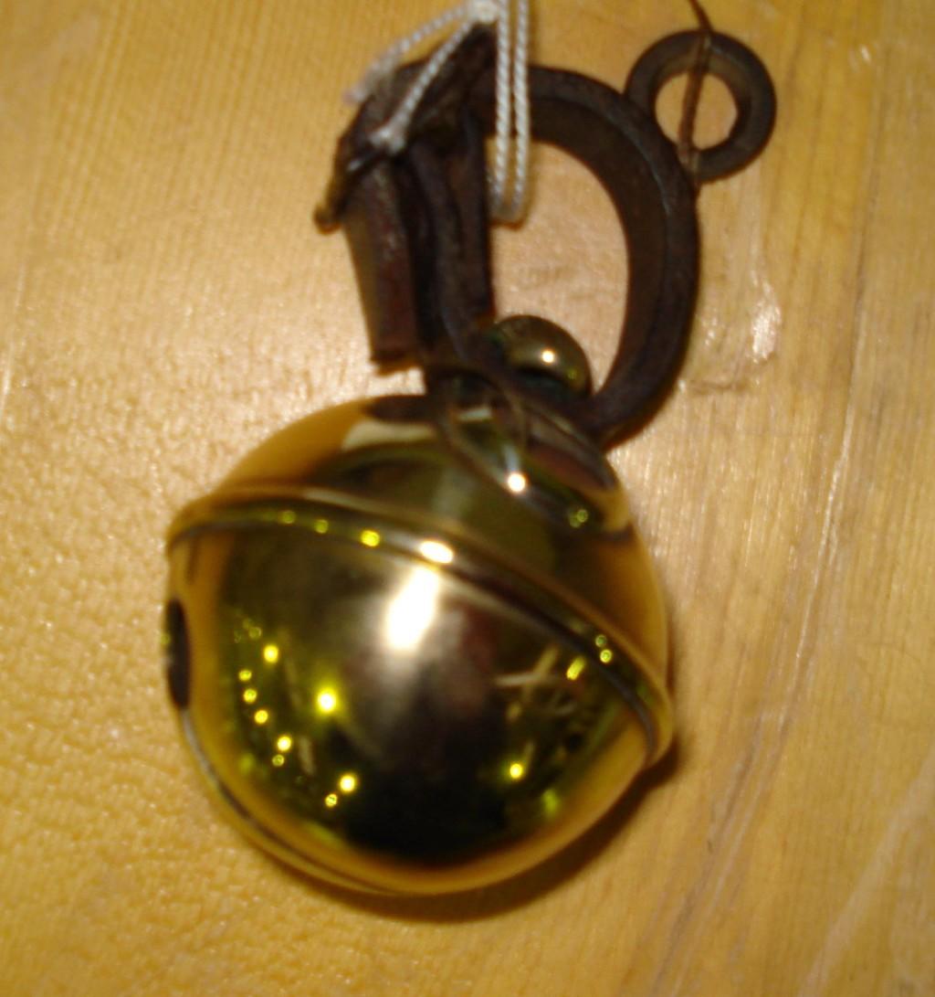 Bonhams Cars : A brass cycle bell on leather strap,