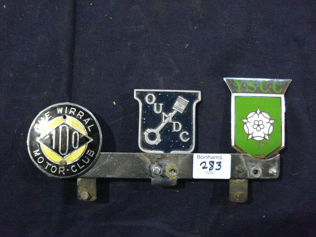 Bonhams Cars : A badge bar and badges,