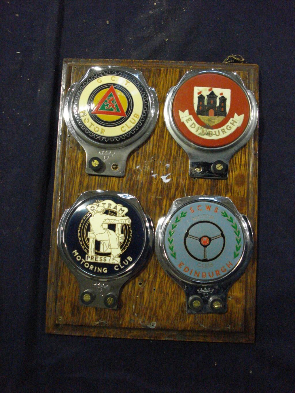 Bonhams Cars : A display board of Scottish car badges,