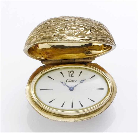 Bonhams : Cartier. A fine and rare 9ct gold concealed watch in the form ...