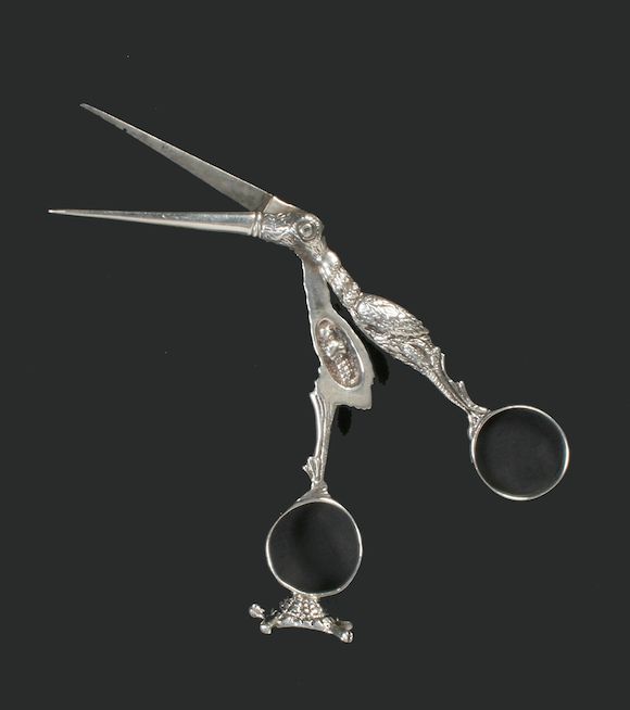 Bonhams : A pair of Dutch silver stork scissors of standing form