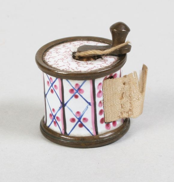 Bonhams : An English enamel tape measure of cylinder form