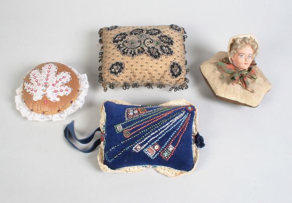 Bonhams : A large rectangular pincushion and three others