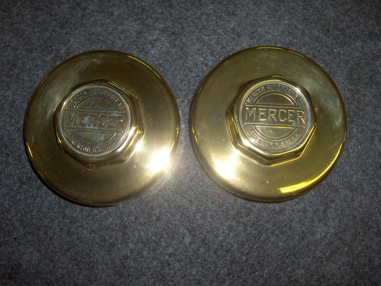 Bonhams Cars : Two Mercer hub caps,,
