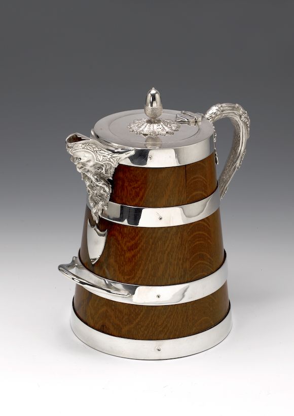 Bonhams : An electroplated mounted wood flagon,