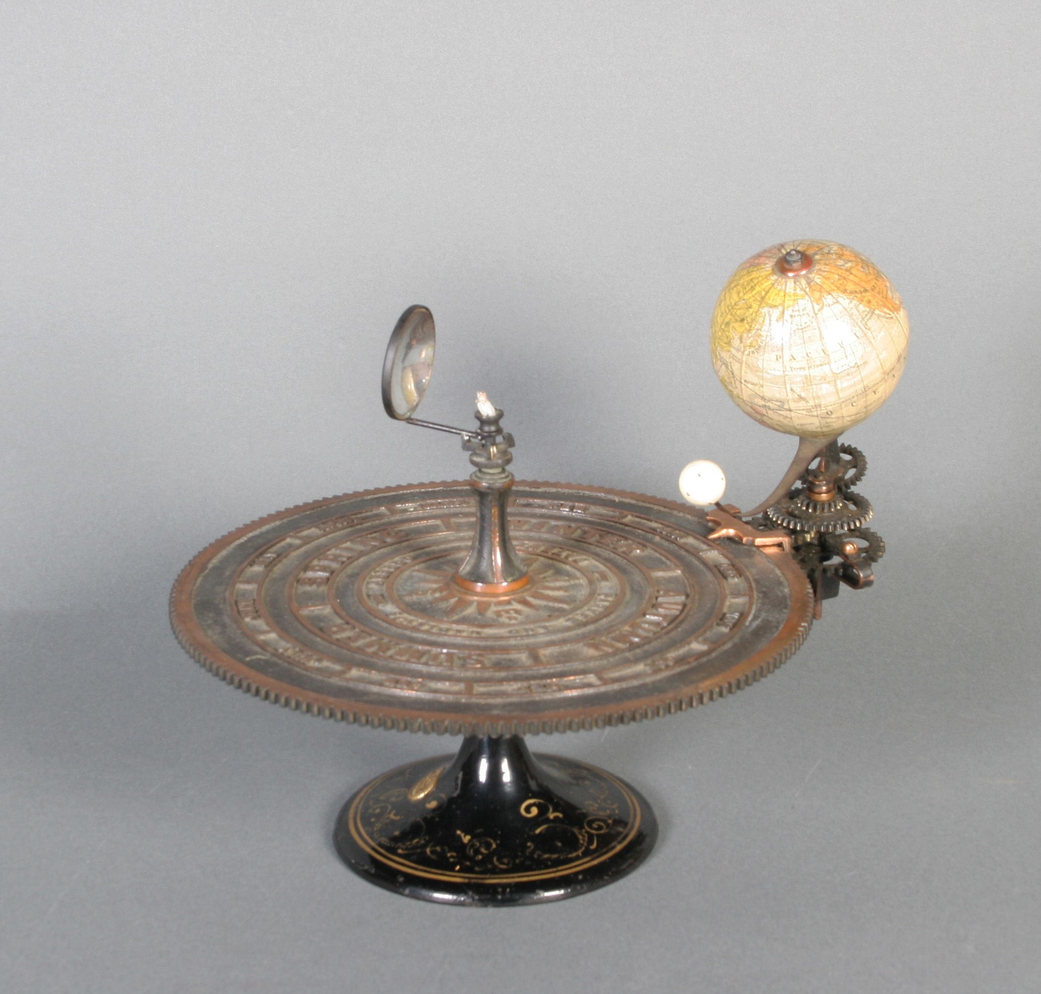 A George Philip & Son finger orrery, English, late 19th century ...