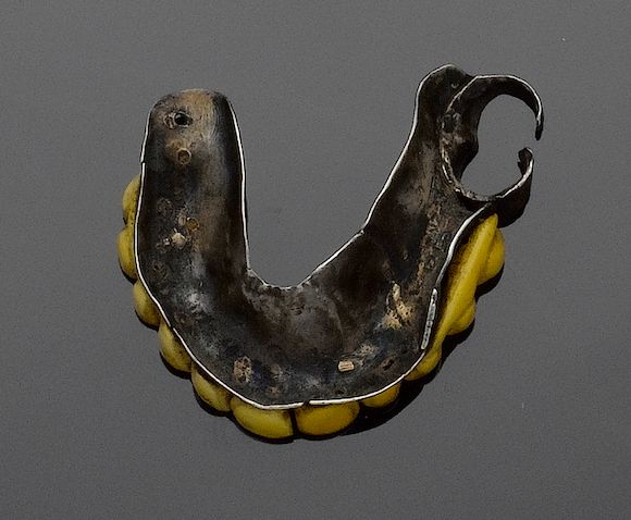 Bonhams : A set of 19th century silver mounted false teeth, apparently ...